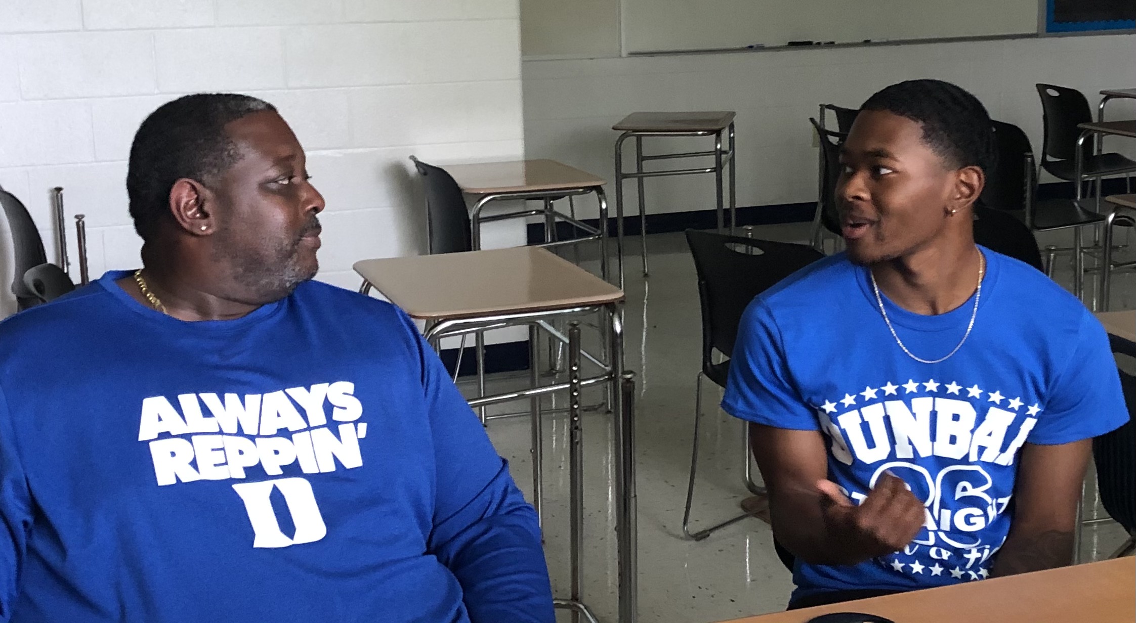 Dunbar valedictorian celebrates with coach/teacher/dad
