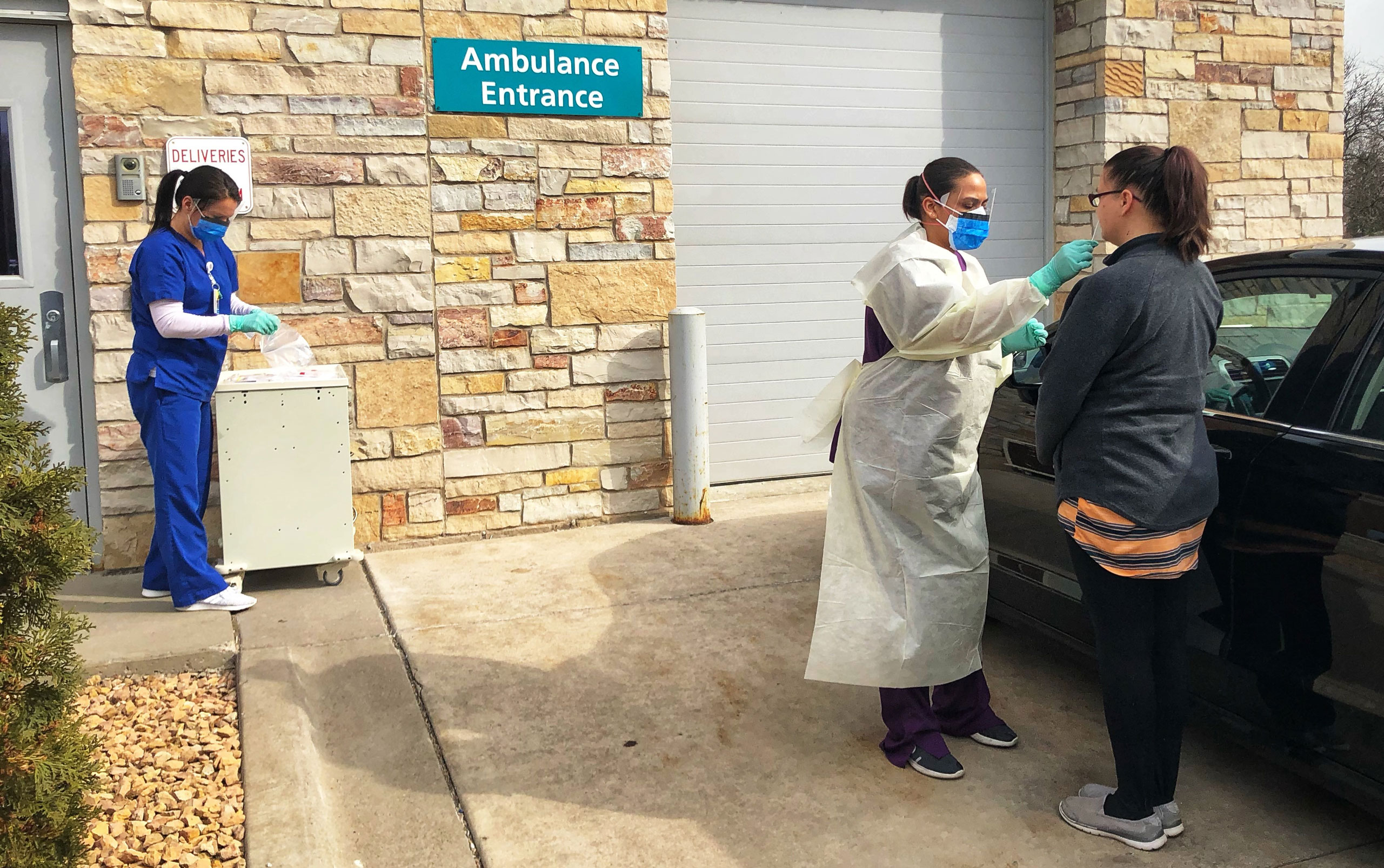 Drive-through coronavirus testing launched by hospitals in parking lots ...