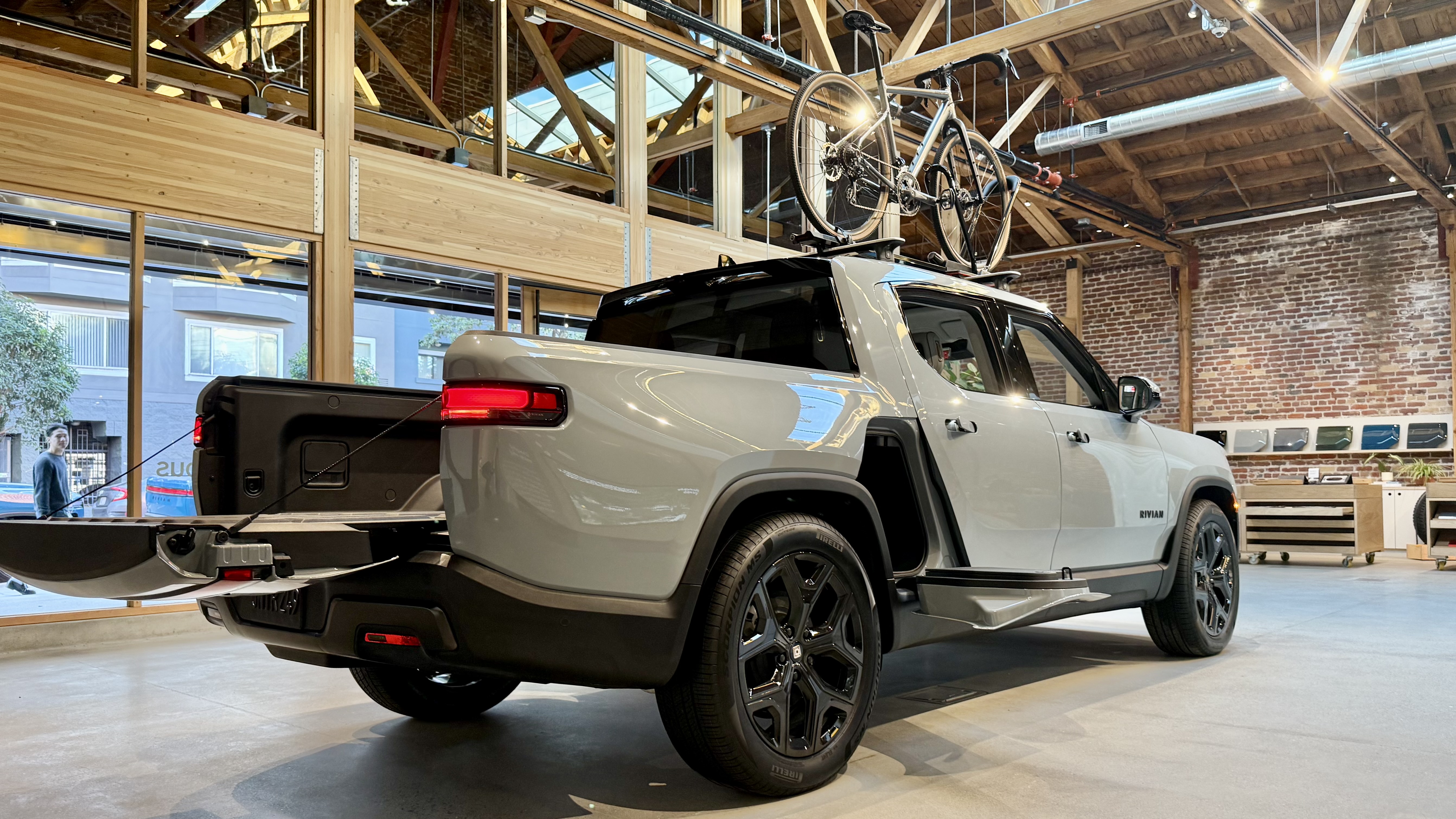 Rivian reports $1.2 billion Q3 loss, revenue up on EV tax credit ...