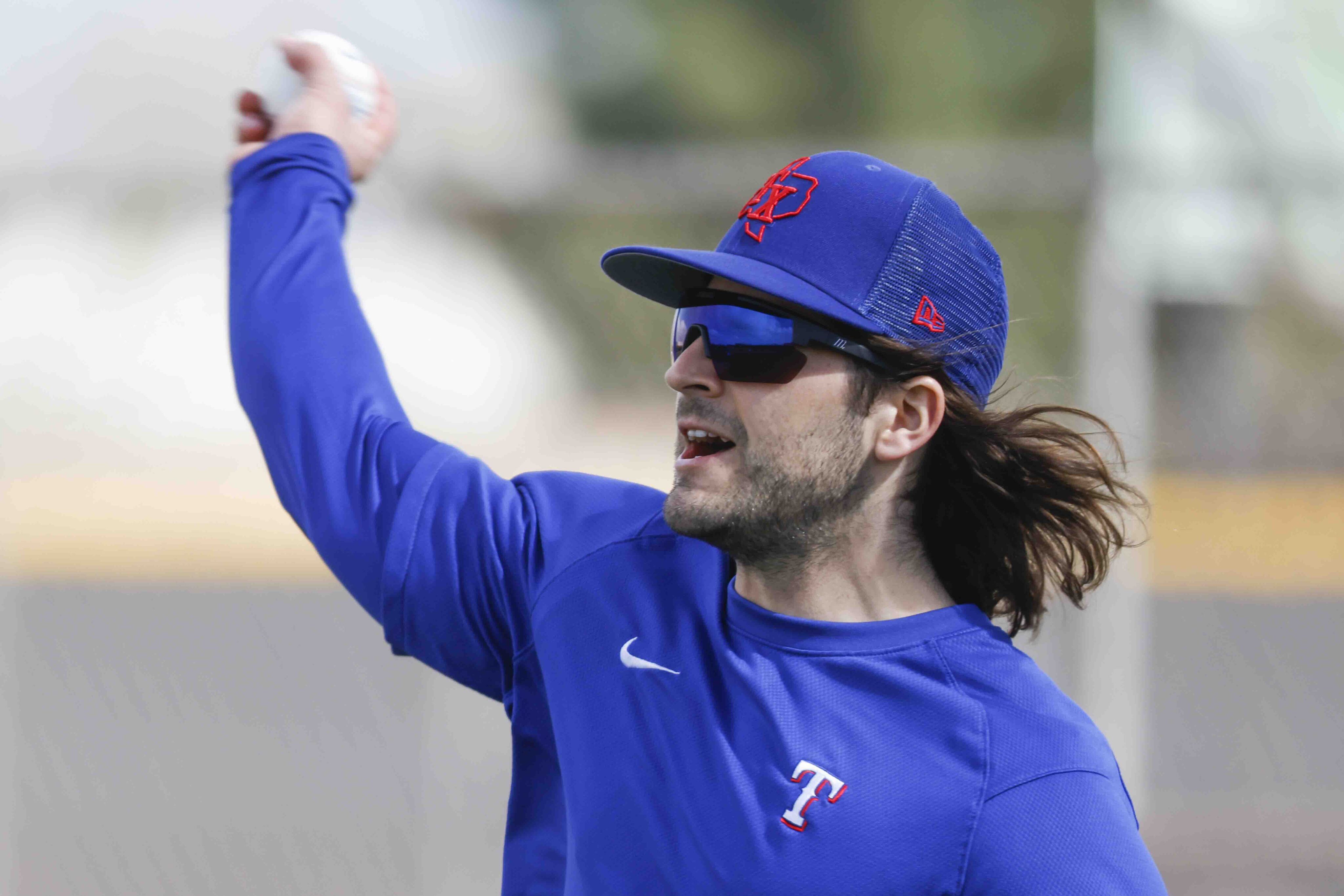 Photos: I got it! Ezequiel Duran catches a ball at Rangers' spring training