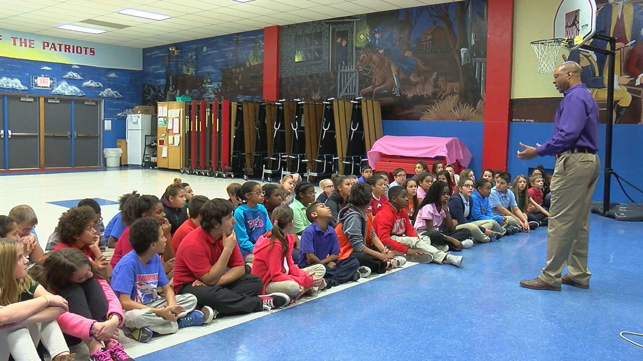 Omega Psi Phi Fraternity visits John Adams elementary school