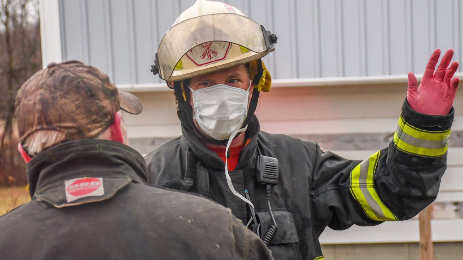 Crews wearing masks while fighting fire