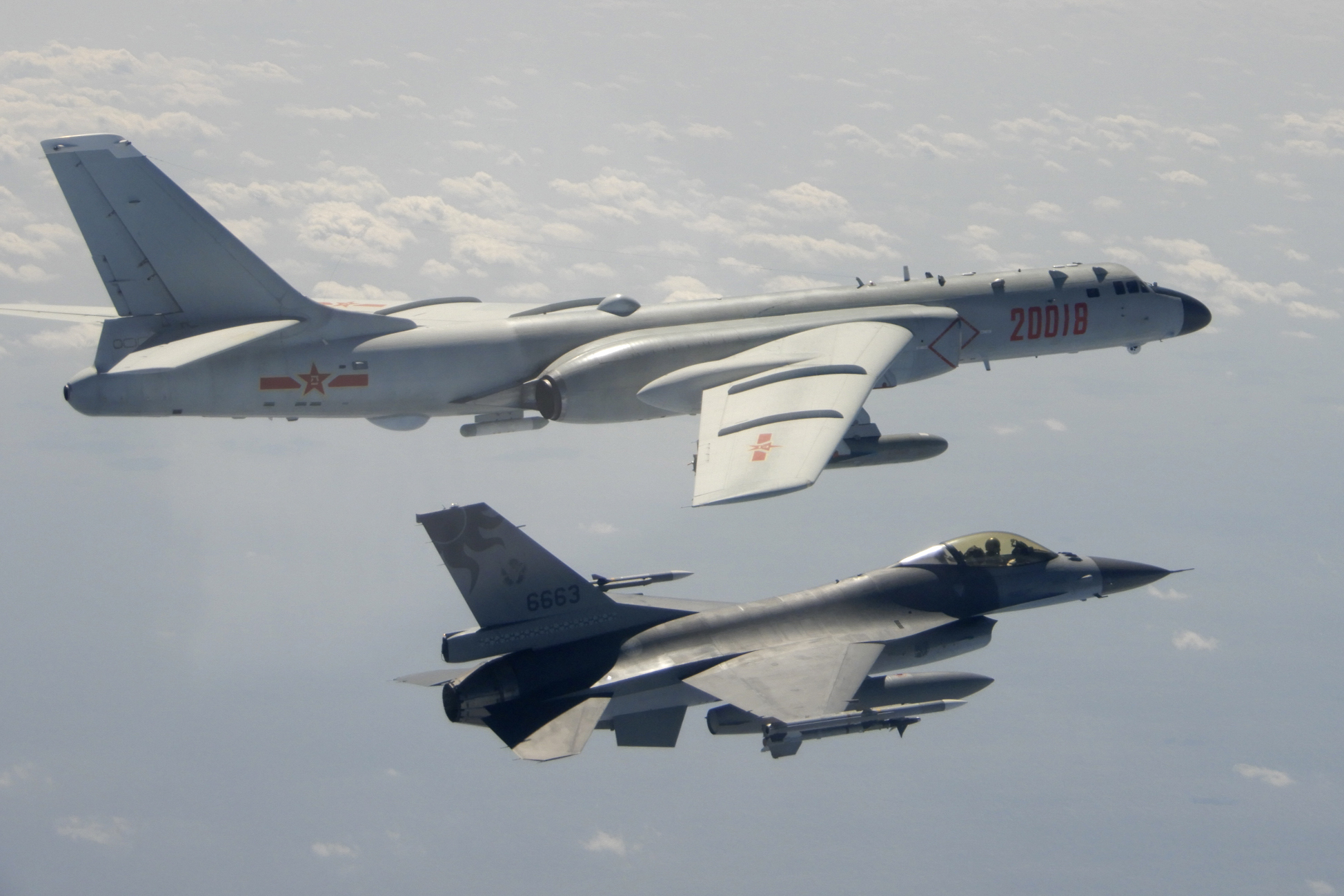 A Republic of China Air Force (ROCAF) F-16, foreground, flies on the ...