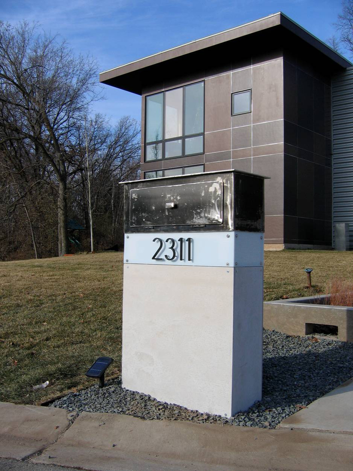 Custom-made mailbox mimics house design