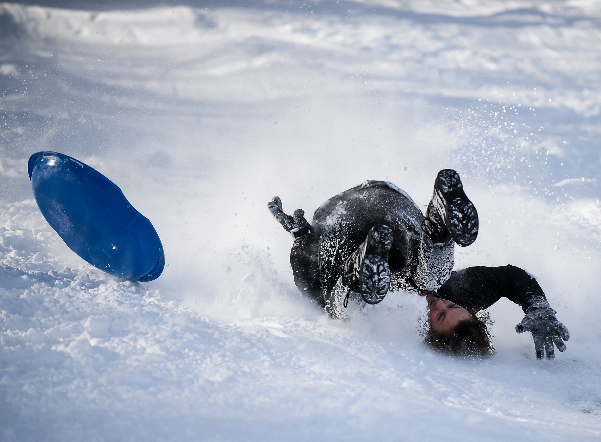 Rough sledding: Snow strands students, flights and commuters