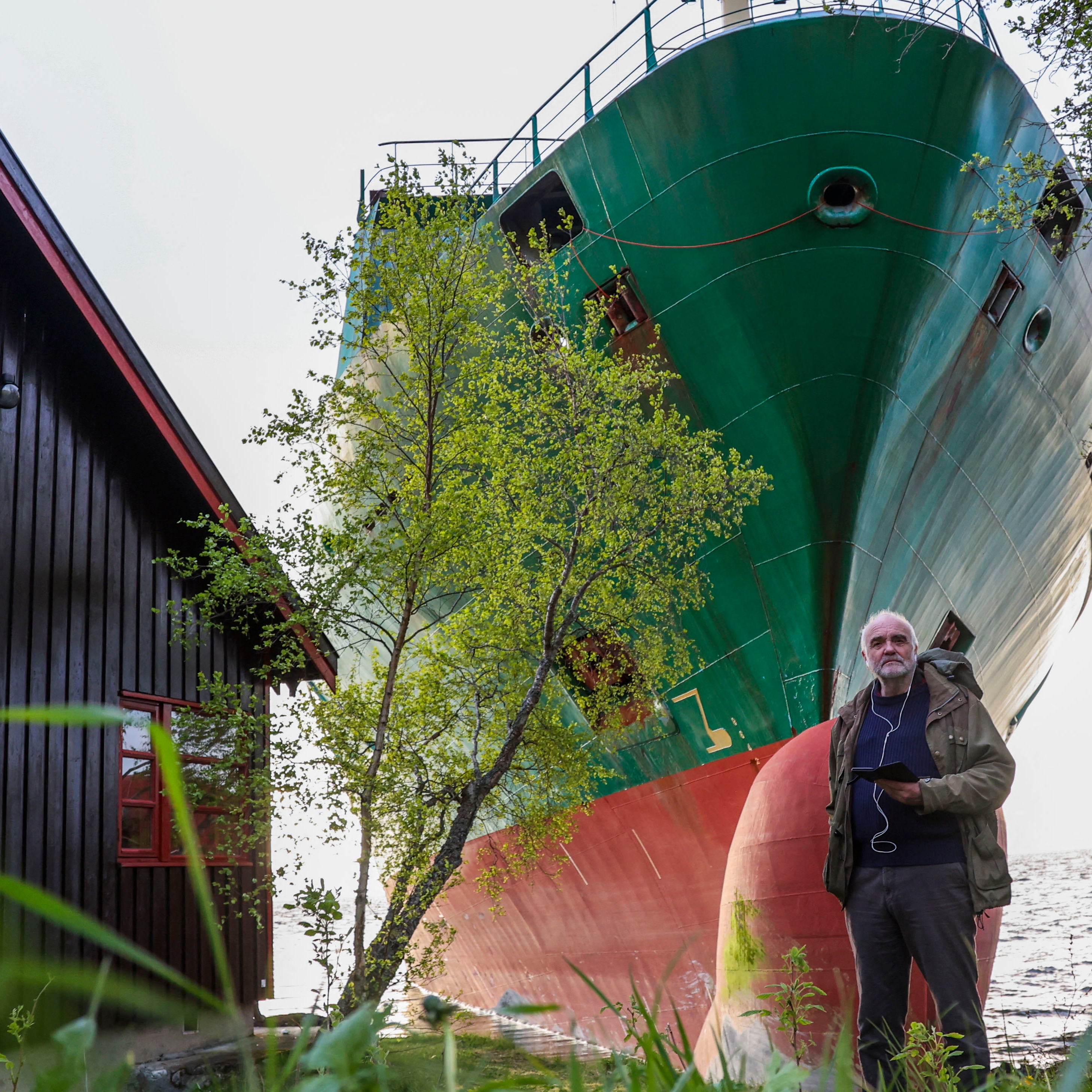 Cargo Ship In Man's Backyard